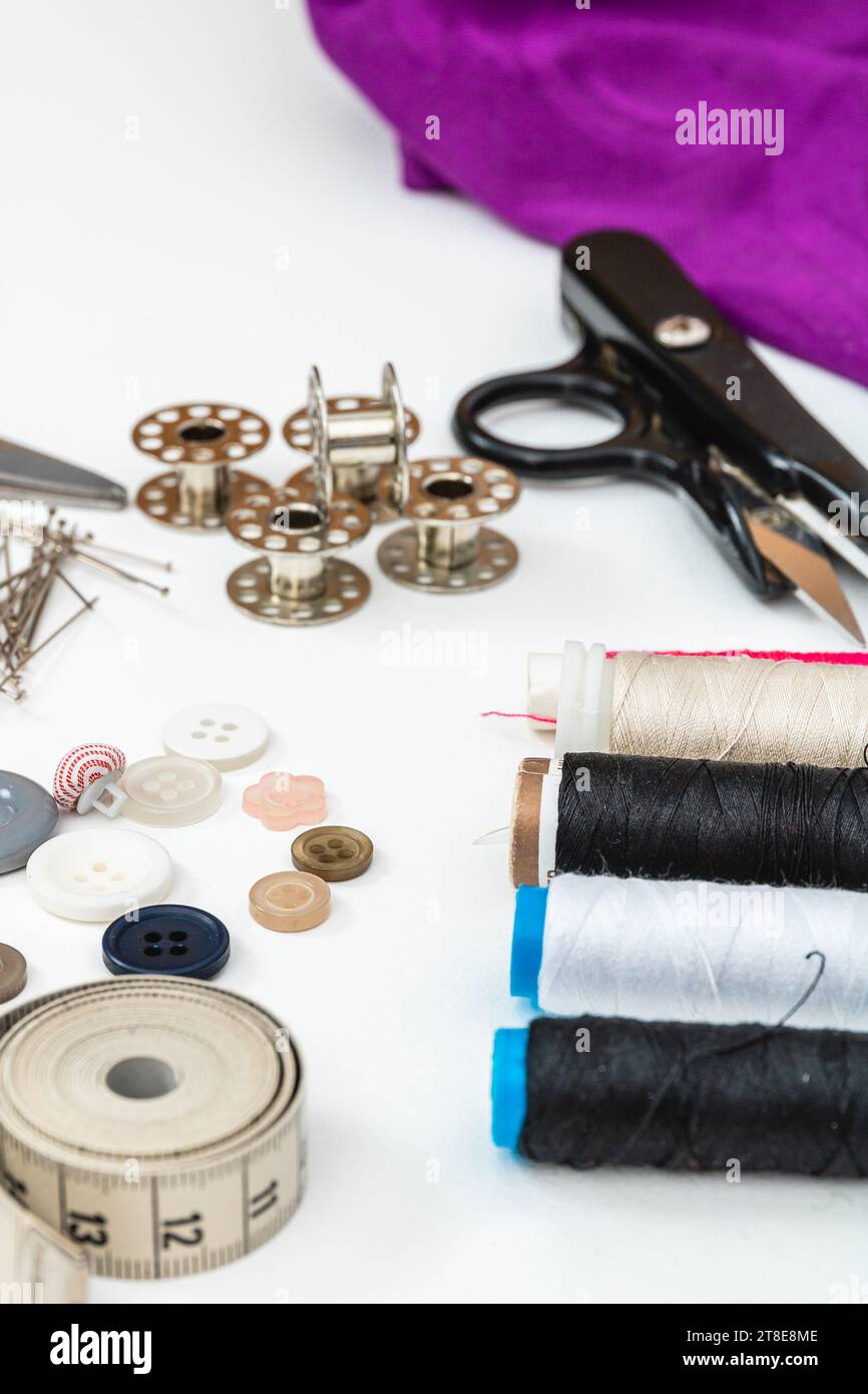 Vertical photo, sewing material presented on a white table, for manual ...