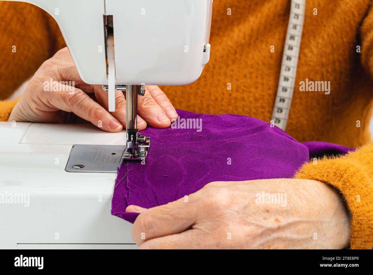 Extreme close up photo, horizontal hands mature adult woman seamstress ...