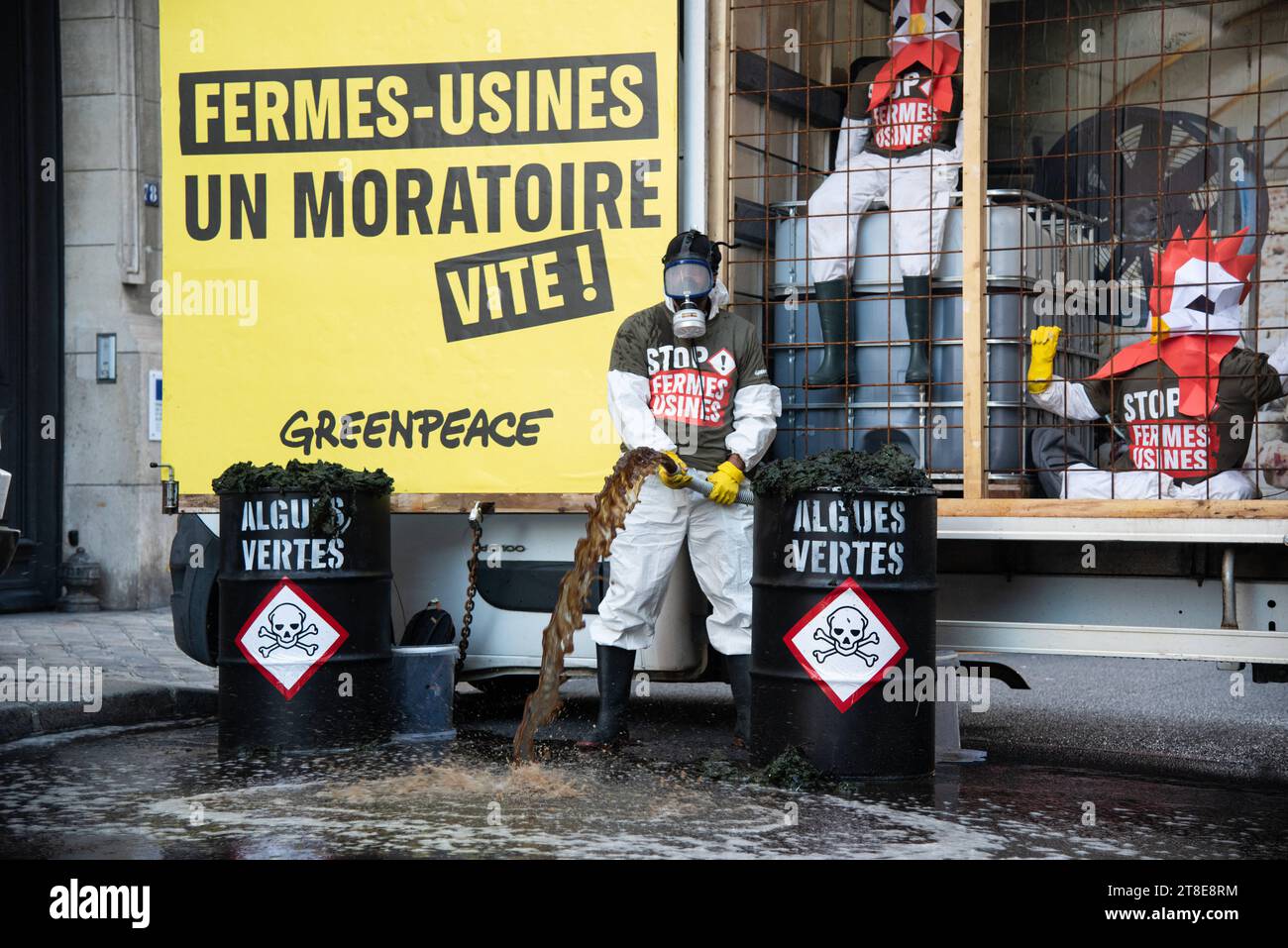 Paris, France. 19th Nov, 2023. Greenpeace activists wearing masks in ...