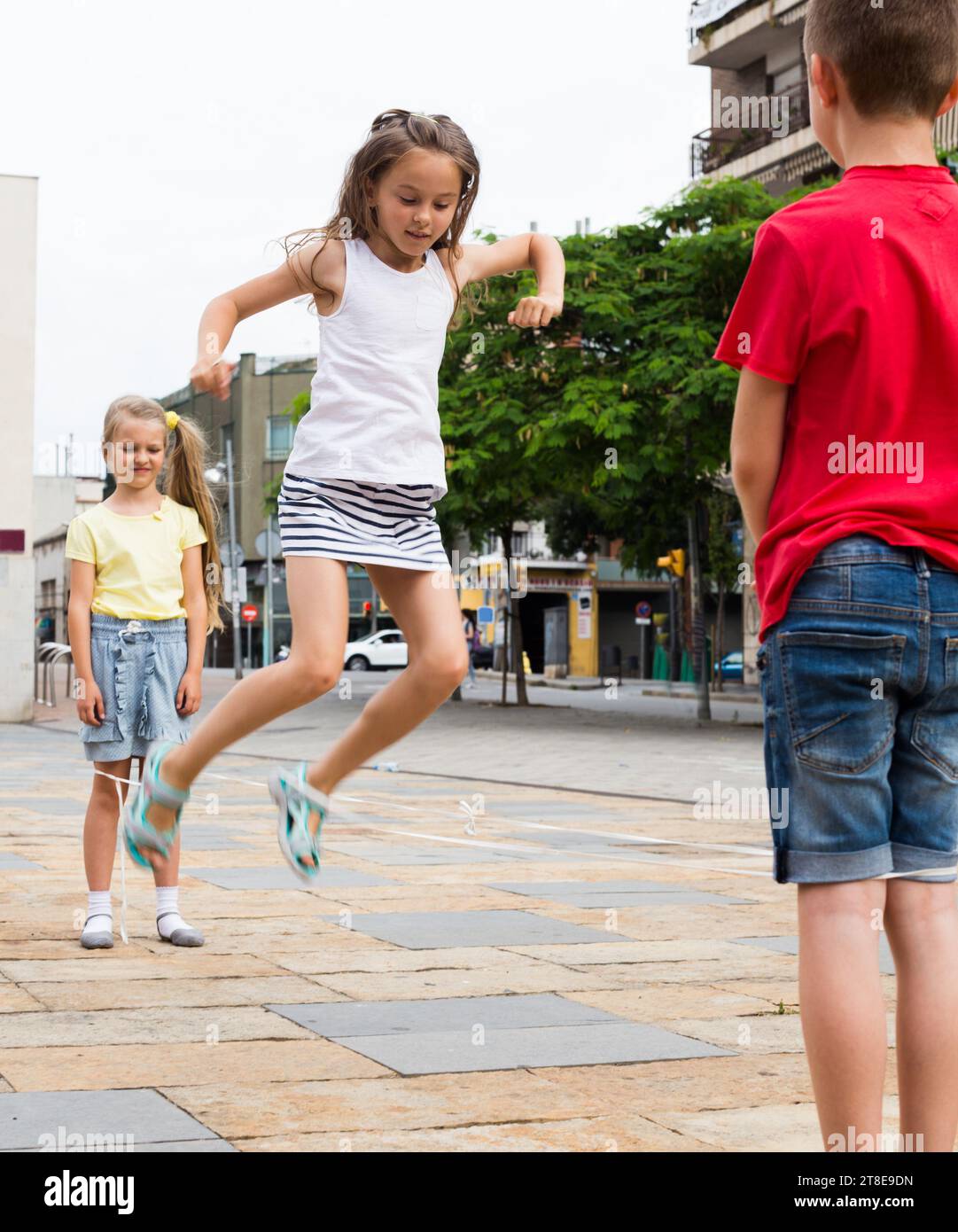 Girl playing on rope over hi-res stock photography and images - Alamy