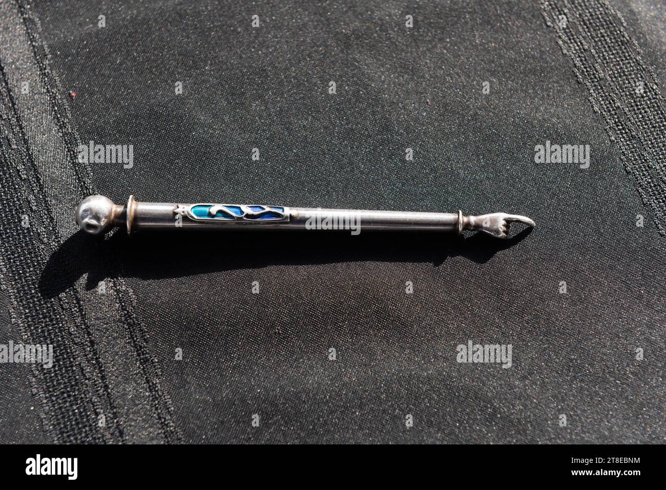 A yad or pointer with a small hand and finger used to assist the Torah ...