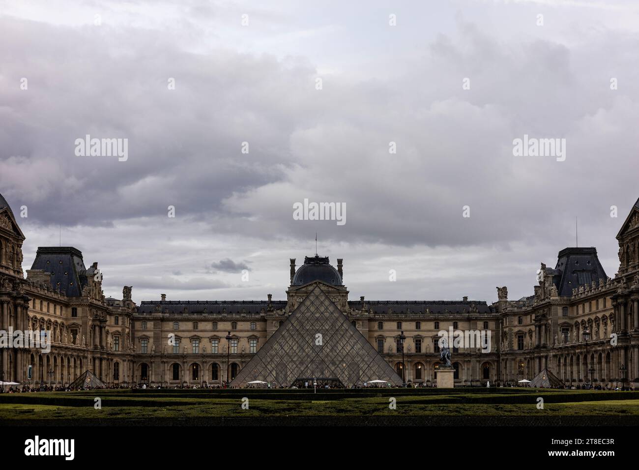 louvre museum cloudy day pyramid and palace Stock Photo - Alamy