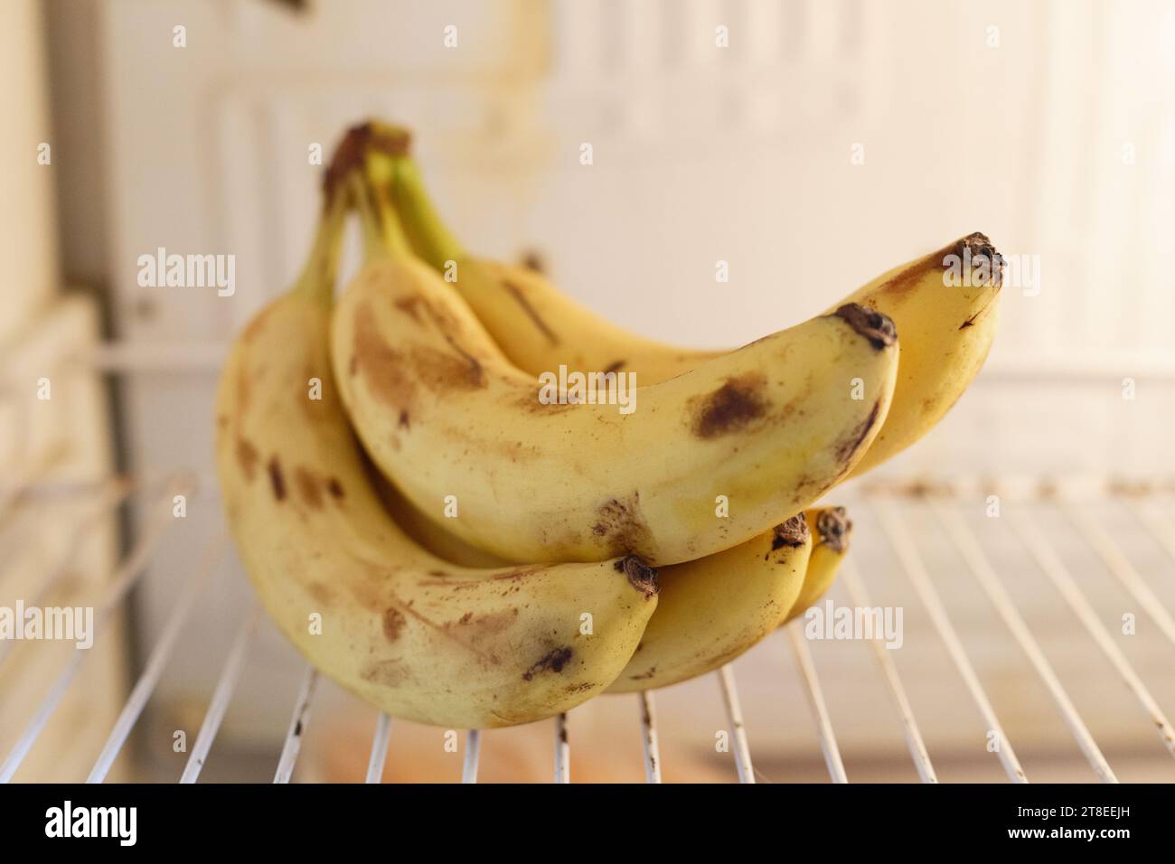 Bunch of bananas on a shelf in the refrigerator Stock Photo - Alamy
