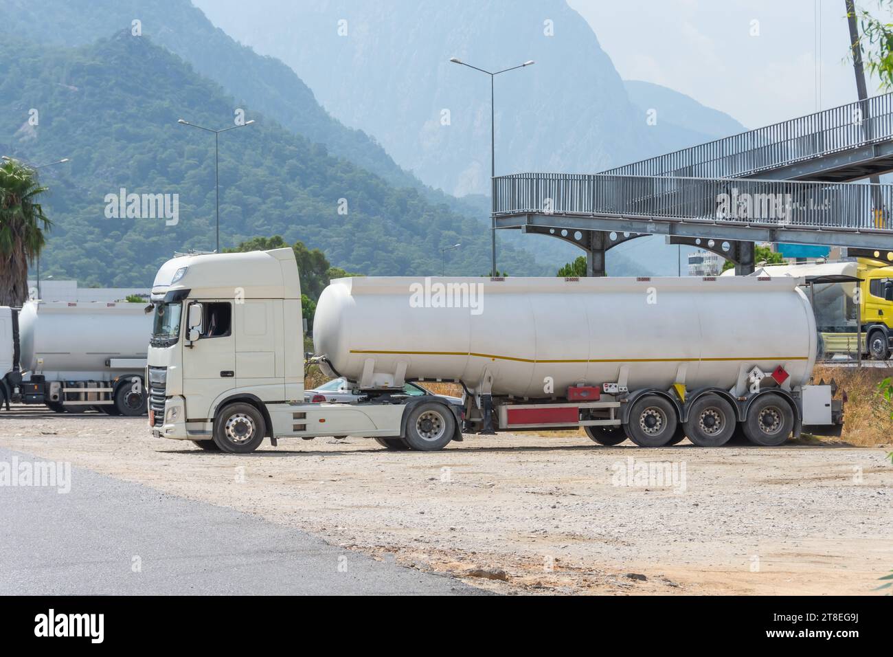 Truck with tank trailer parked near highway reserve fuel storage ...