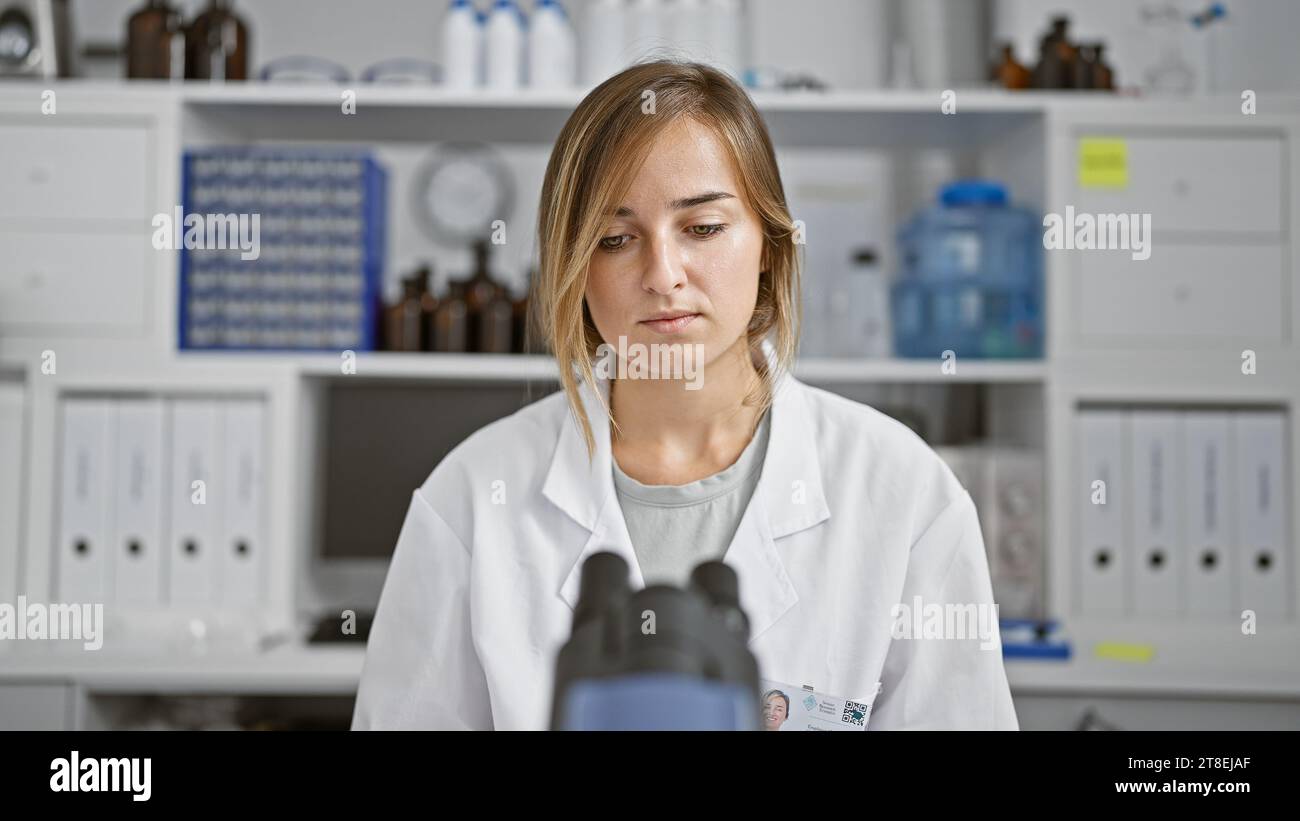 In the heart of science, young attractive blonde woman scientist ...