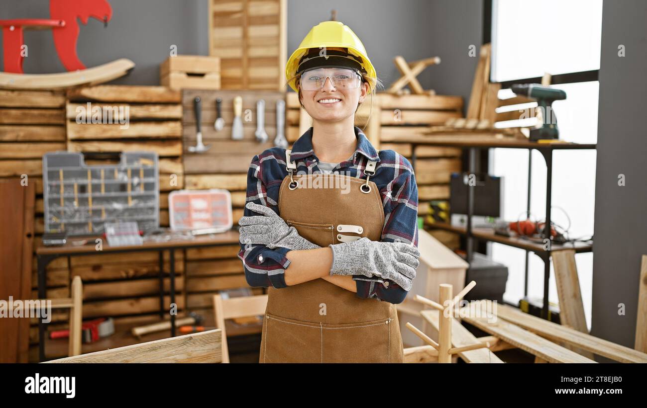 Young, beautiful blonde carpenter, a portrait of confidence at her ...