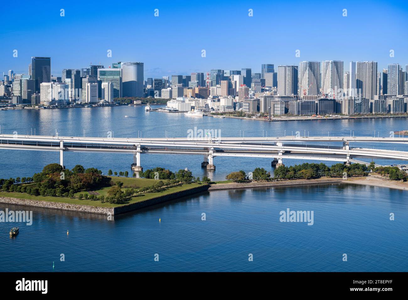 View of Tokyo Bay with Rainbow Bridge and boats Stock Photo - Alamy