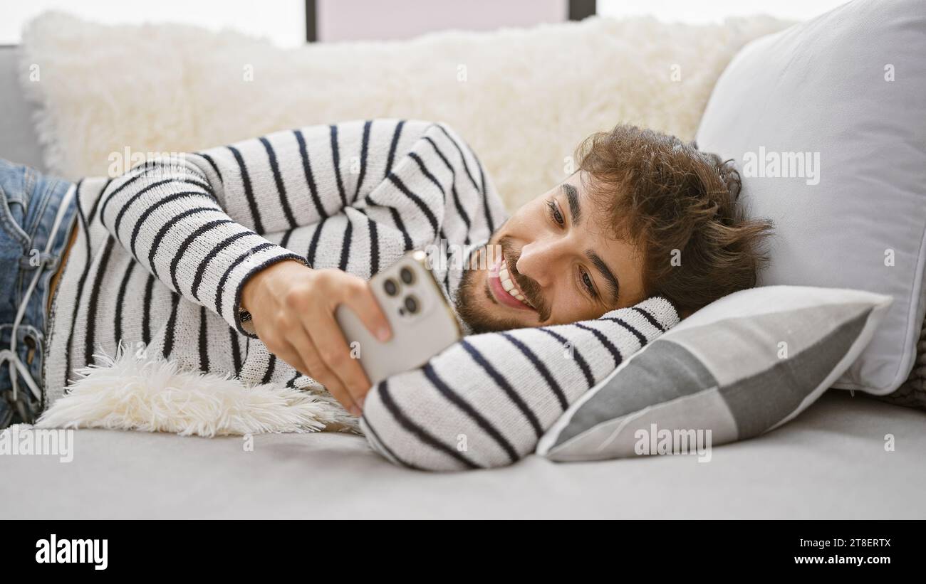 Positive arabian man texting phone hi-res stock photography and images ...