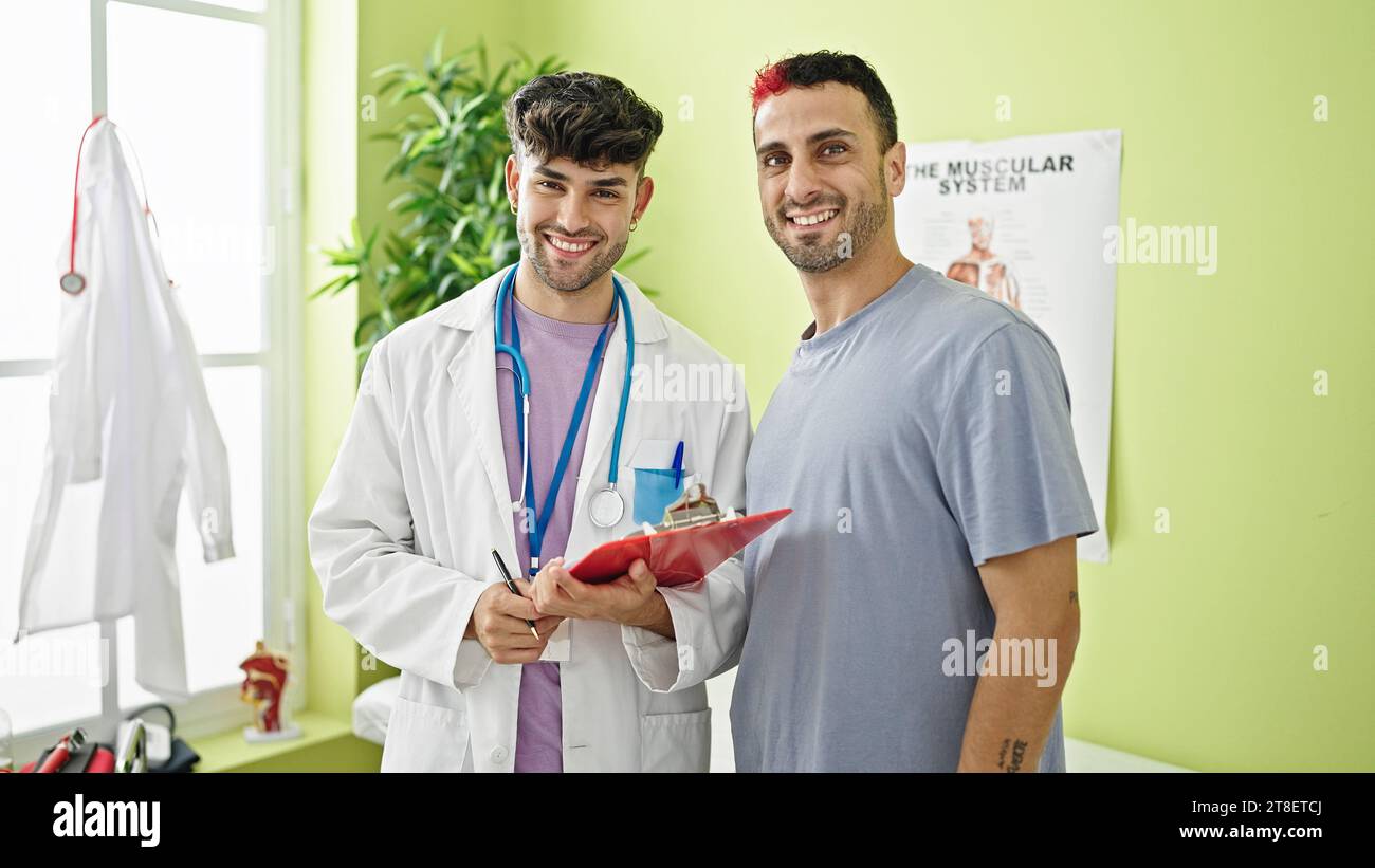 Two men doctor and patient smiling confident standing at clinic Stock ...