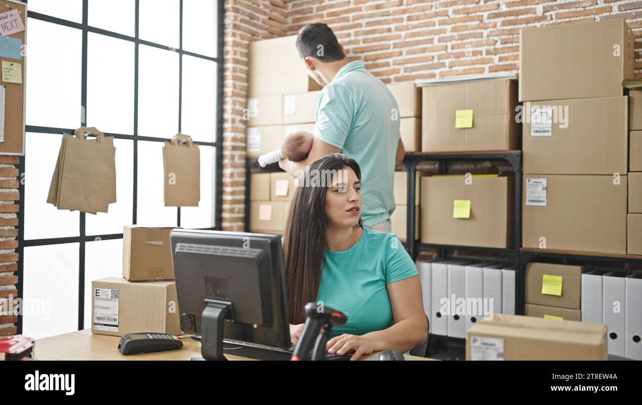 Family of three working at ecommerce business at office Stock Photo - Alamy