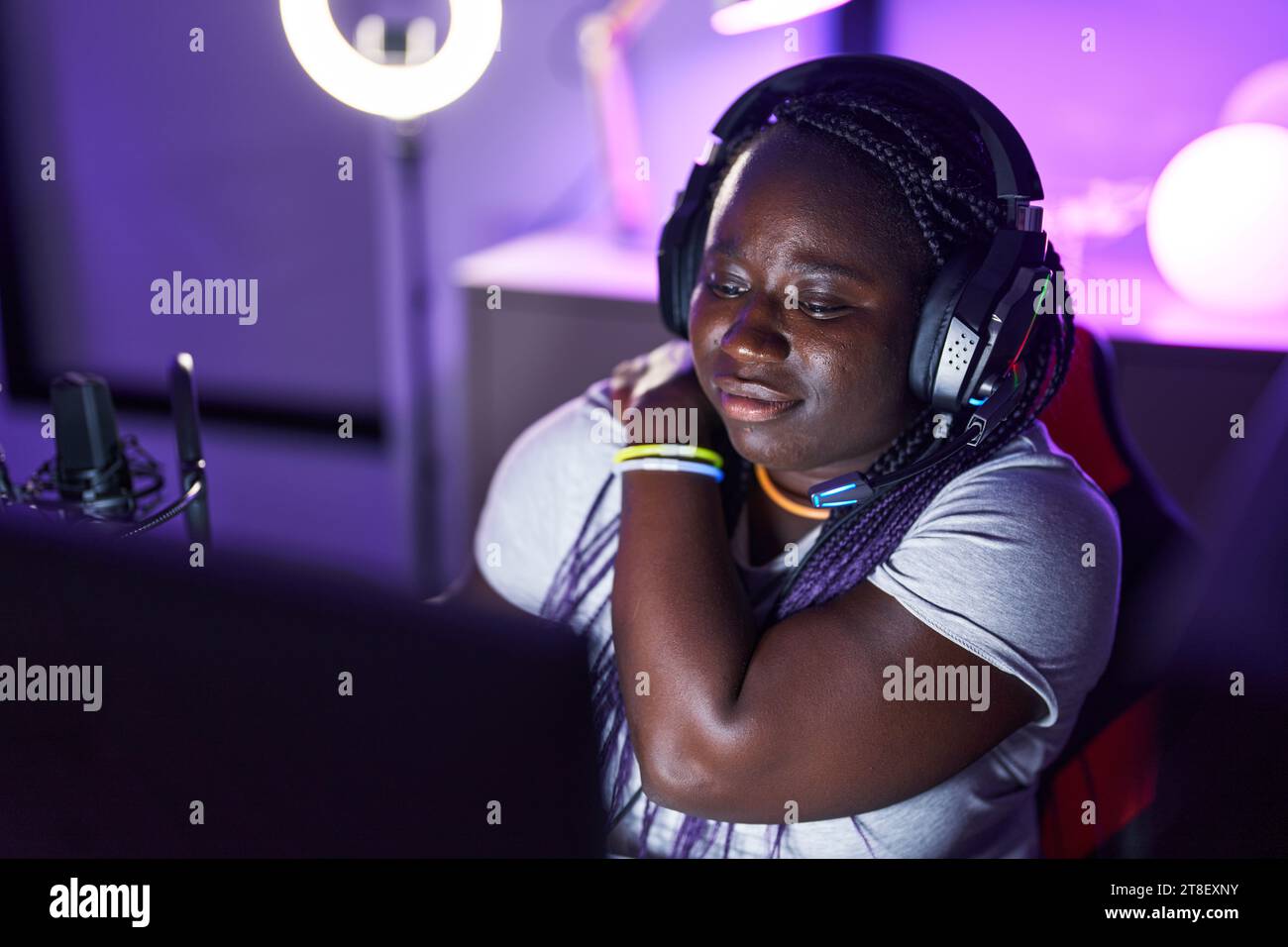 African american woman streamer stressed using computer at gaming room ...