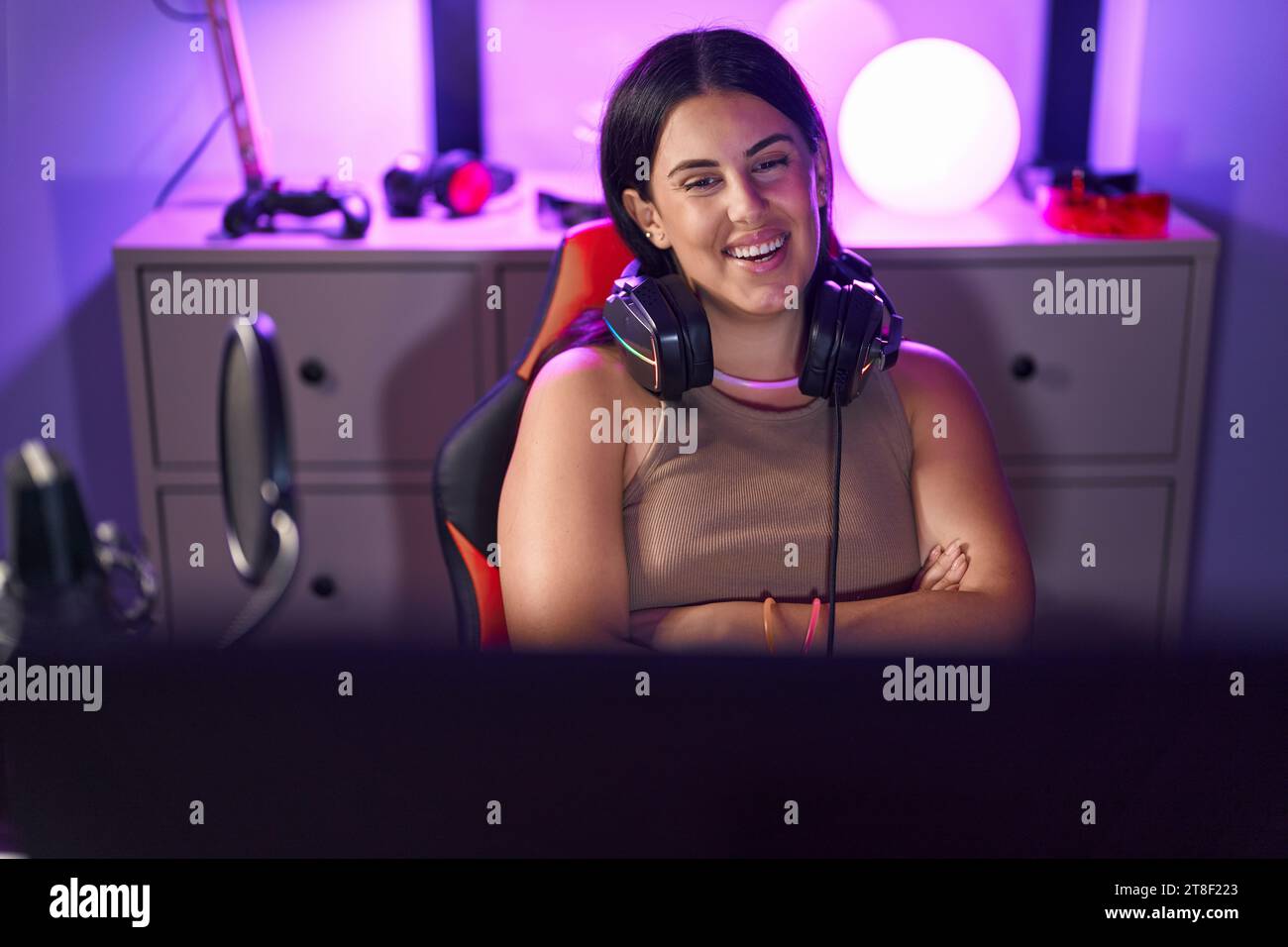 Young beautiful hispanic woman streamer smiling confident sitting with ...