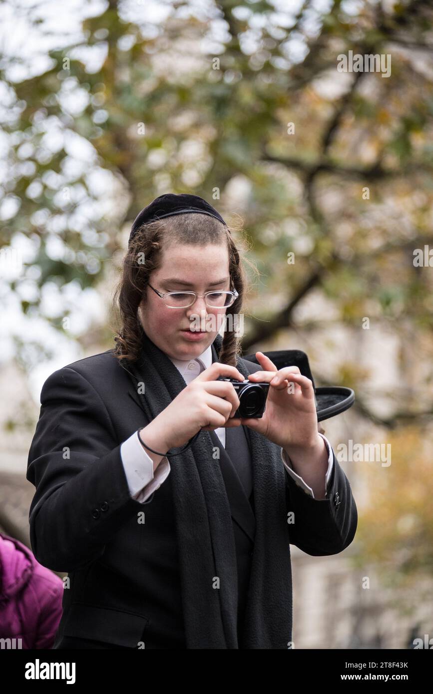 Jewish boy with a camera at the AJEX Annual Parade & Ceremony at the ...