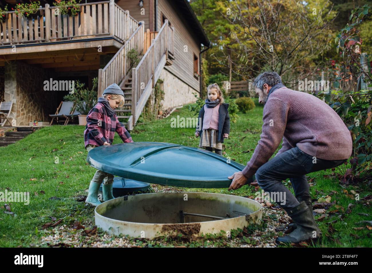 The family checks the water quality in the home wastewater treatment ...