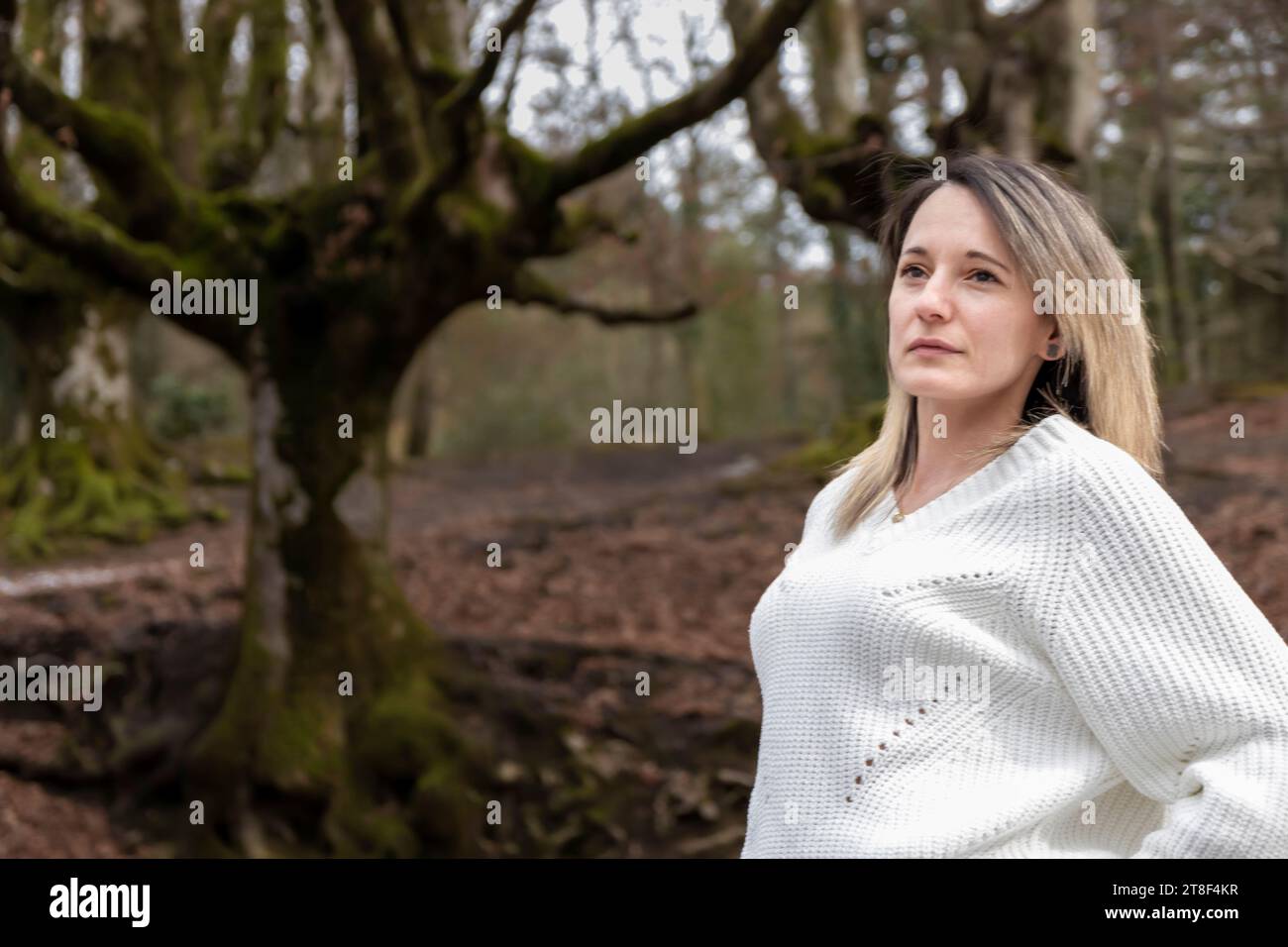 Person in white sweater hi-res stock photography and images - Alamy