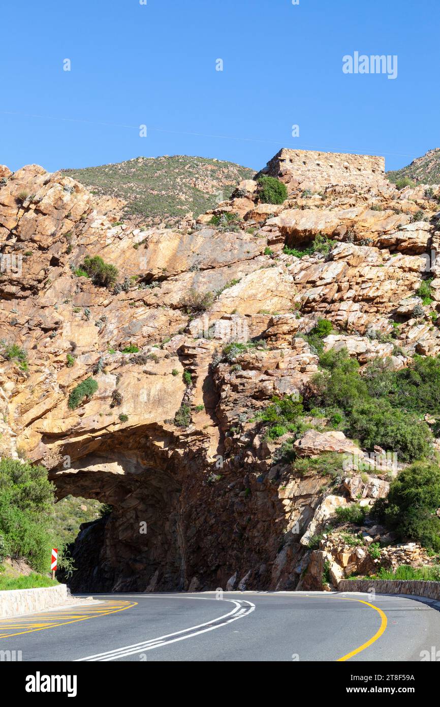 Road tunnel through the rocks and ruined British Fort, Cogmanskloof ...