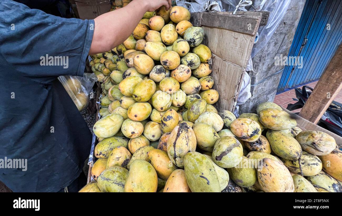 View of a person selling mango fruits at World's largest market in ...