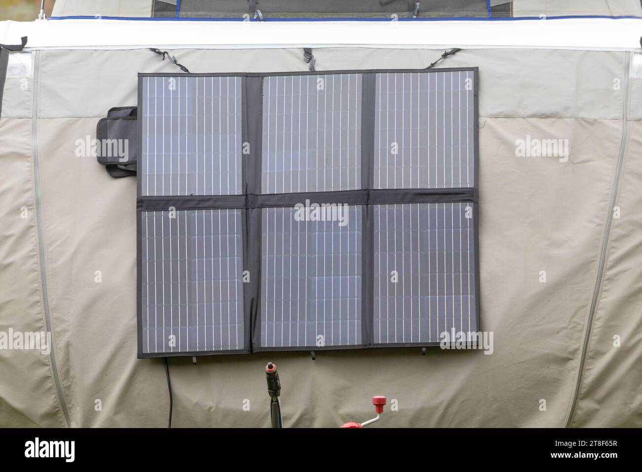 Portable folding solar panel or solar blanket mounted to the back of a ...