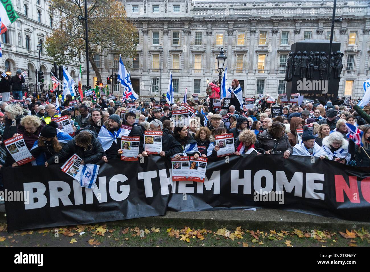Protestors holding pictures of people kidnapped by Hamas, 'Never Again ...