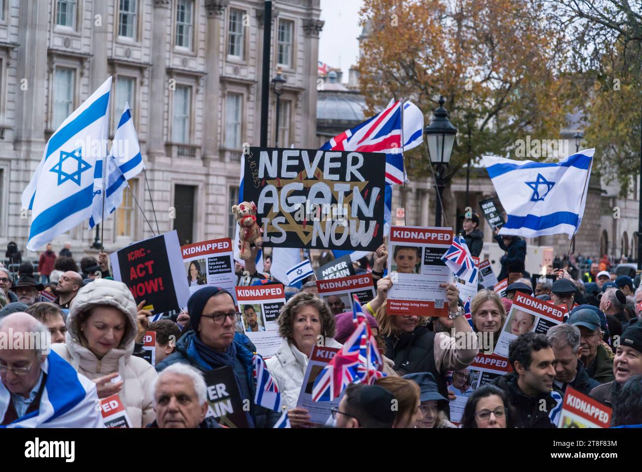 Protestors holding pictures of people kidnapped by Hamas, 'Never Again ...