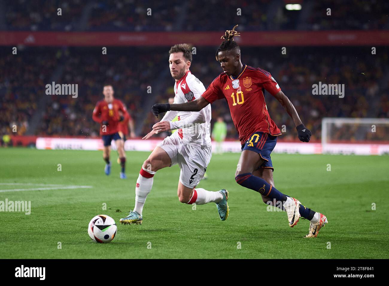 Nico Williams of Spain duels for the ball with Otar Kakabadze of ...