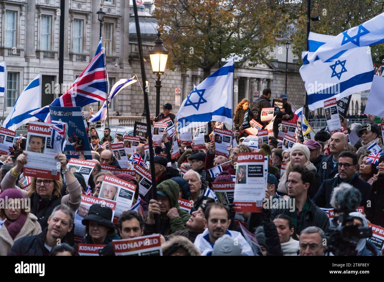 Protestors holding pictures of people kidnapped by Hamas, 'Never Again ...