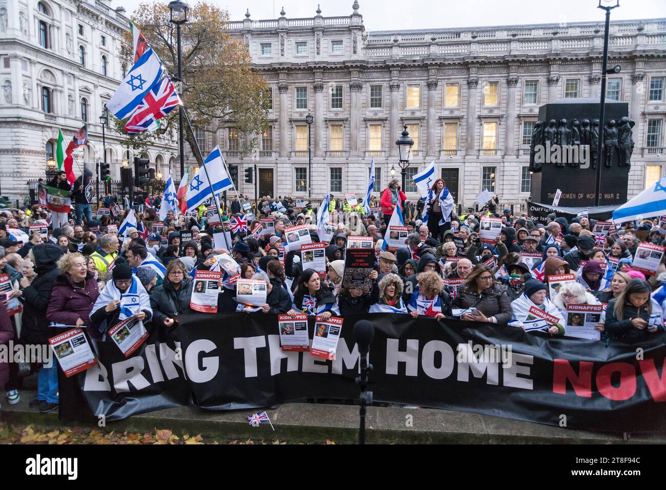 Protestors holding pictures of people kidnapped by Hamas, 'Never Again ...