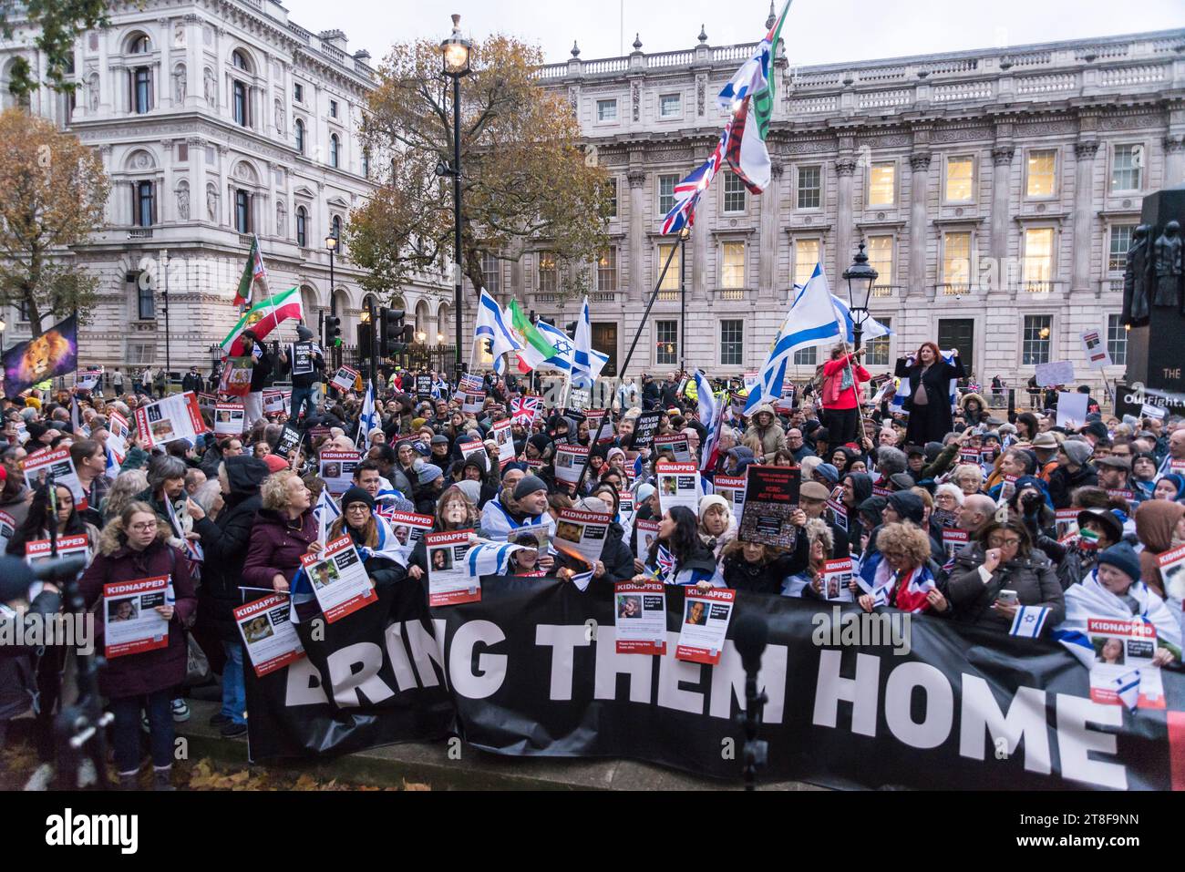 Protestors holding pictures of people kidnapped by Hamas, 'Never Again ...