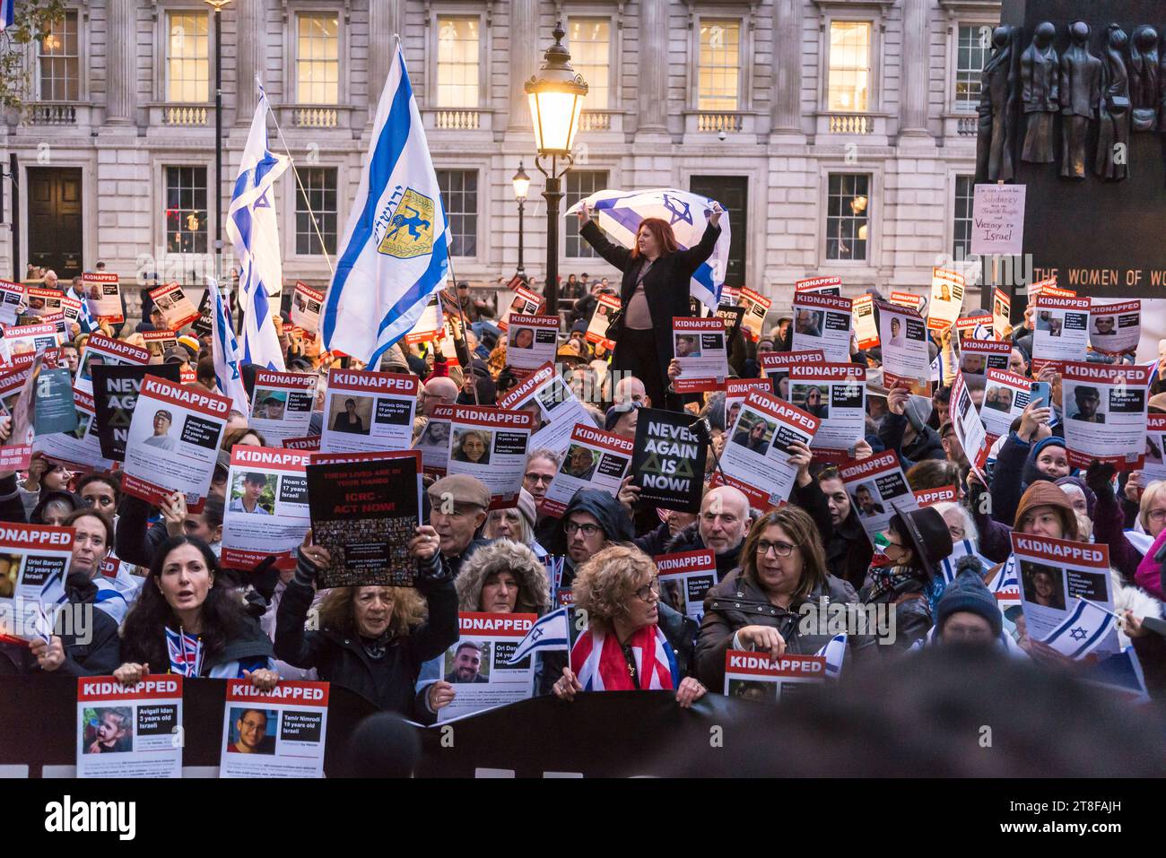 Protestors holding pictures of people kidnapped by Hamas, 'Never Again ...