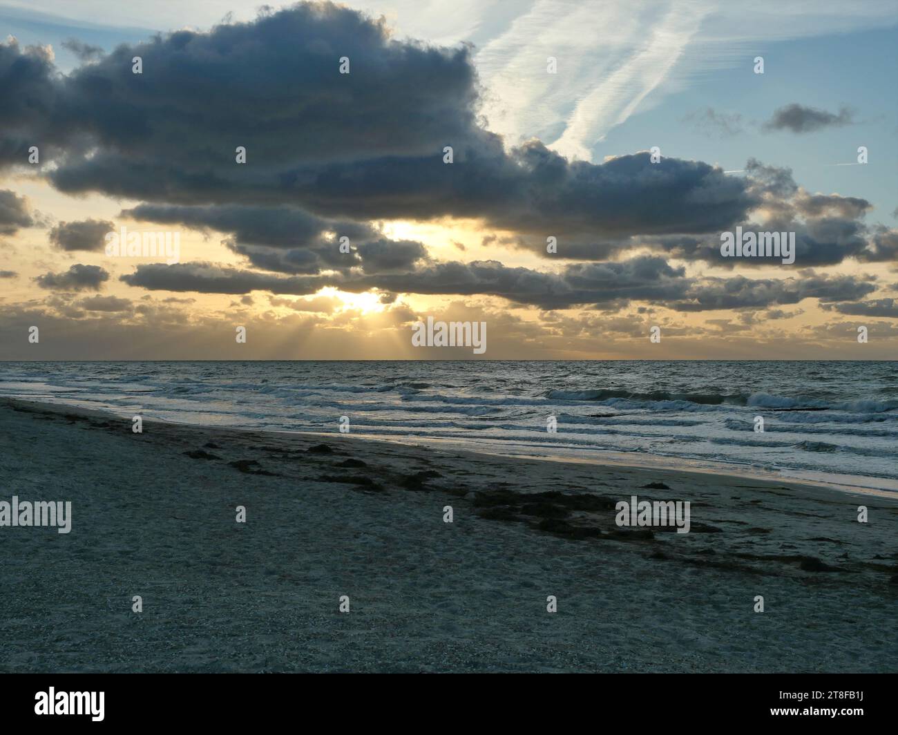 Sunset at the Baltic Sea beach. Each sunset is unique and can create a ...