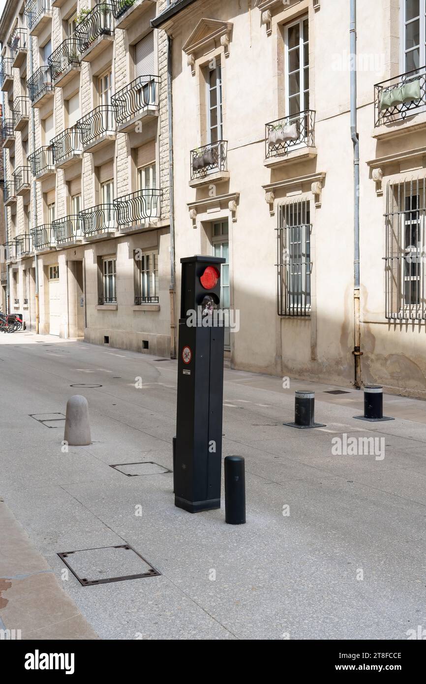 red light on a vehicle access machine controlling street entry bollards ...