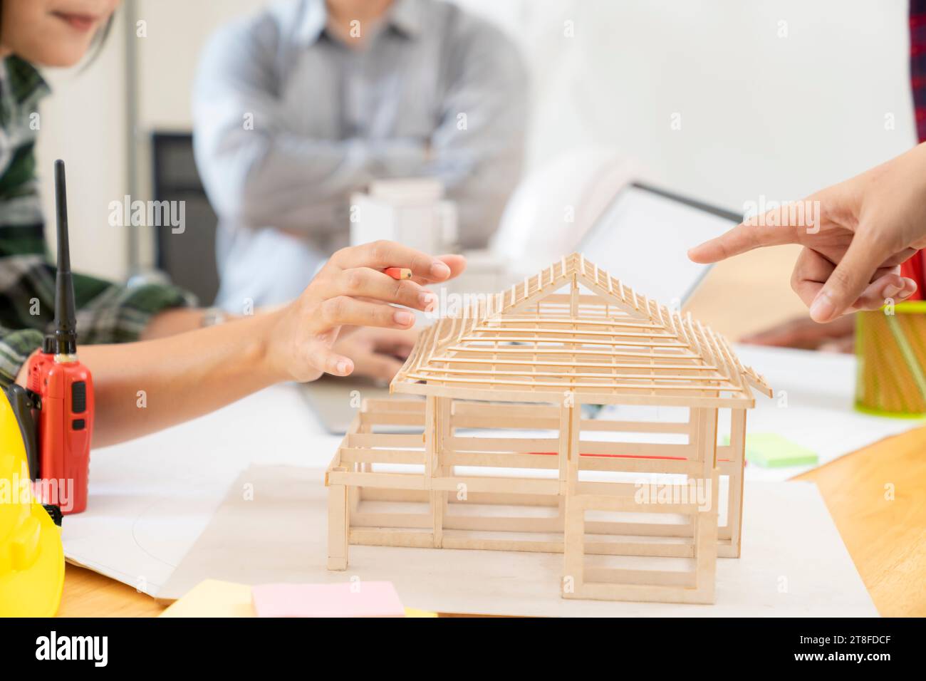 The collaborative work of a group of architects inspecting the ...