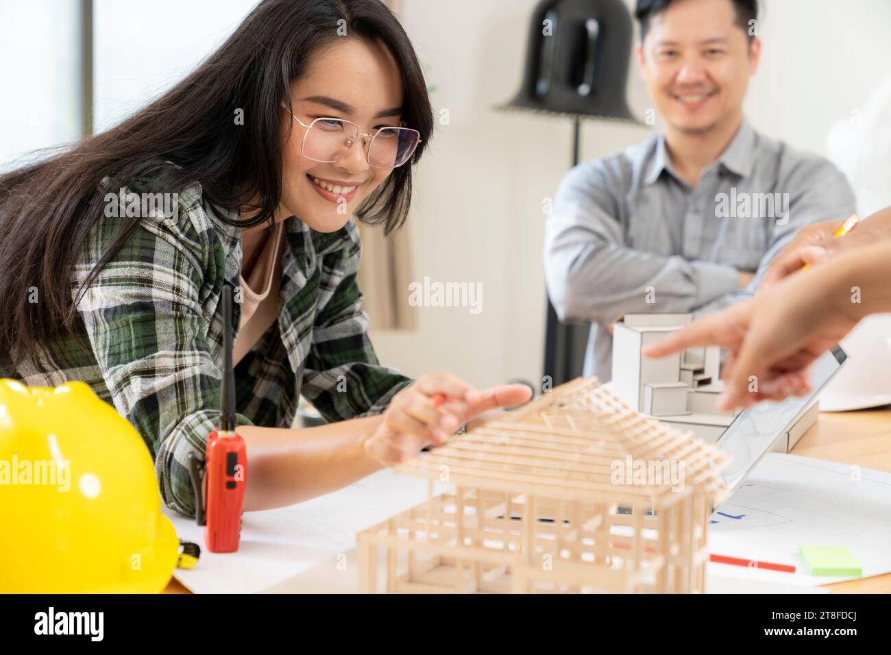 The collaborative work of a group of architects inspecting the ...