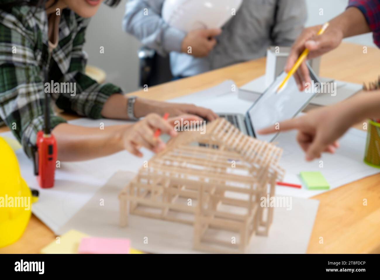 The collaborative work of a group of architects inspecting the ...