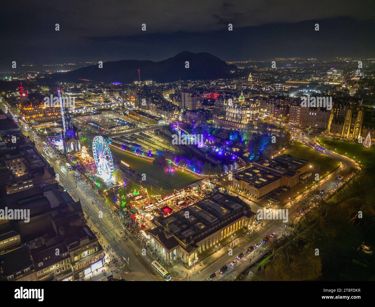 Aerial view at night of Princes Street Gardens and Christmas Market ...