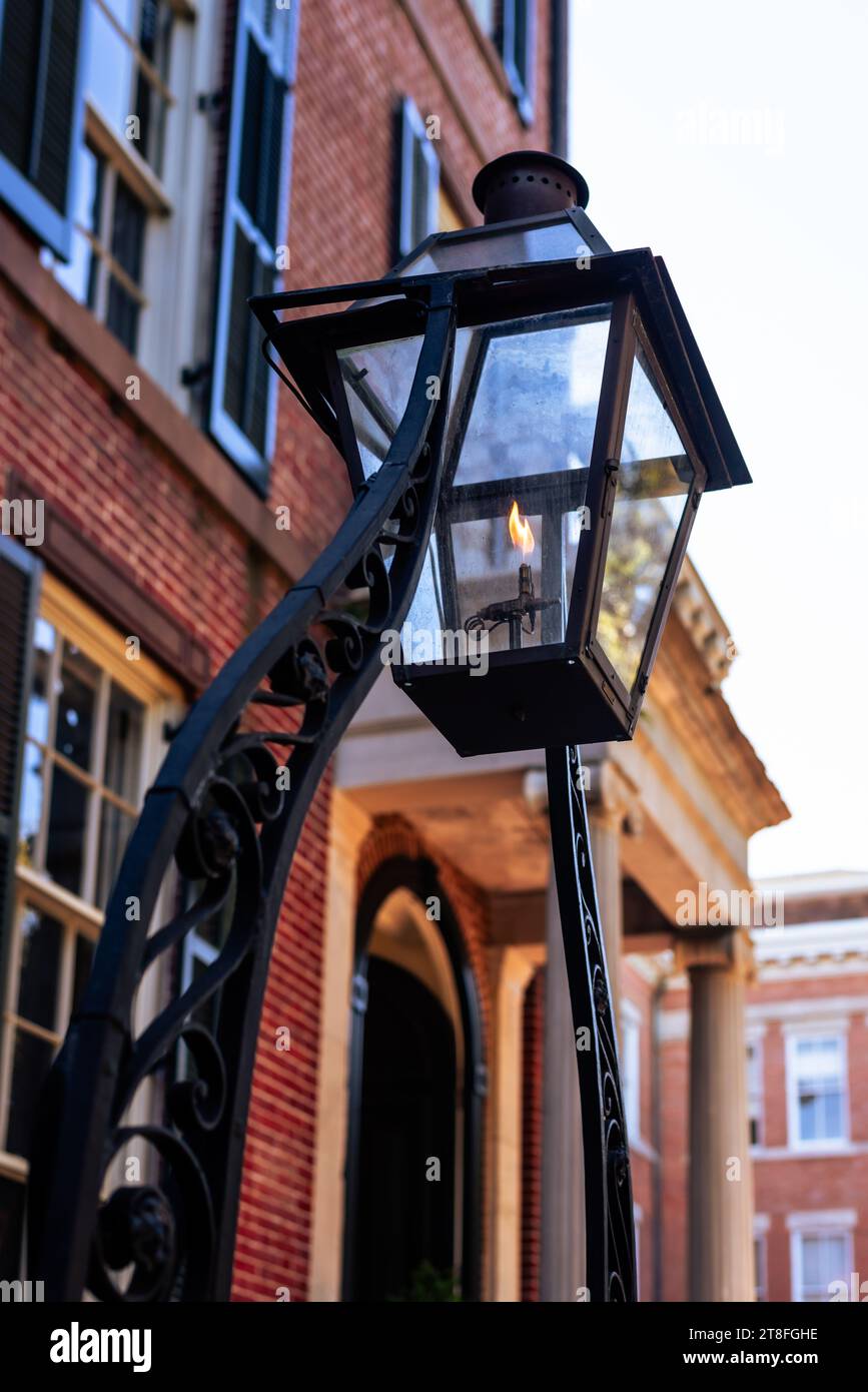 Antique wrought iron gas lantern in front of a beautiful home in ...