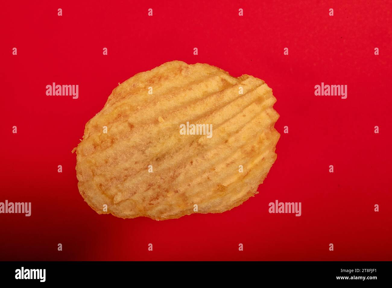 Close up snack food still life of crinkle cut crisps Stock Photo - Alamy