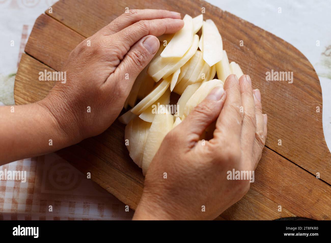 Cut potatoes on board knife hi-res stock photography and images - Alamy