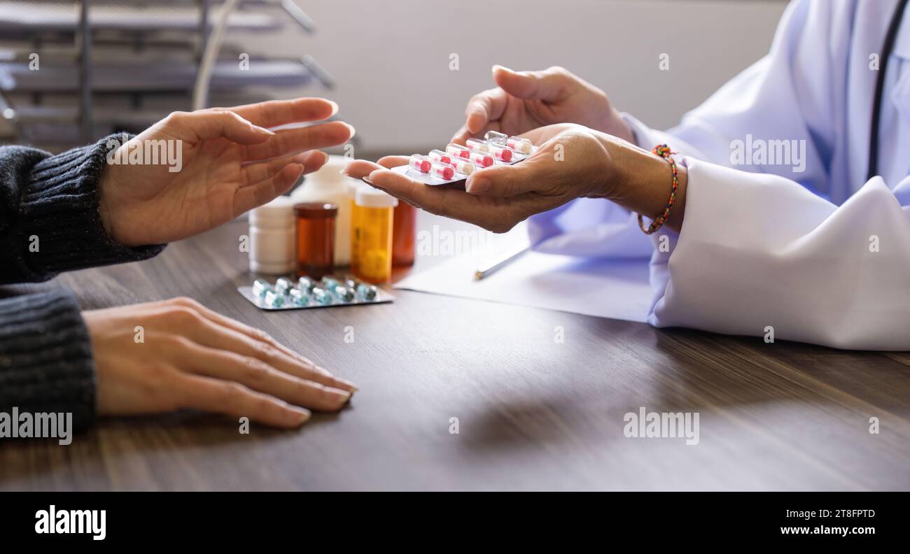 Senior woman doctor recommend pill medical prescription to woman ...