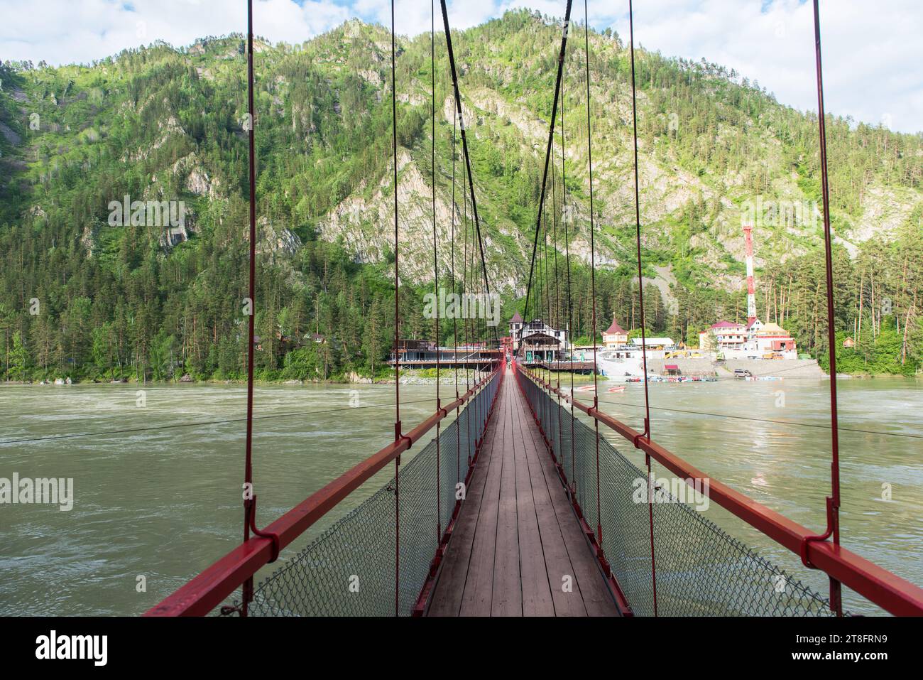 Famous bridge over Katun river in valley of Altai Mountains. Popular ...