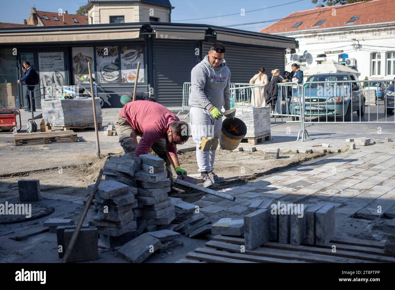 Belgrade, Serbia, Oct 18, 2023: Construction workers paving the plateau ...