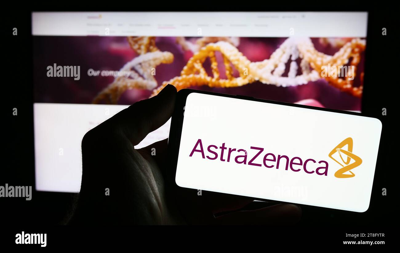 Person holding smartphone with logo of pharmaceutical company ...