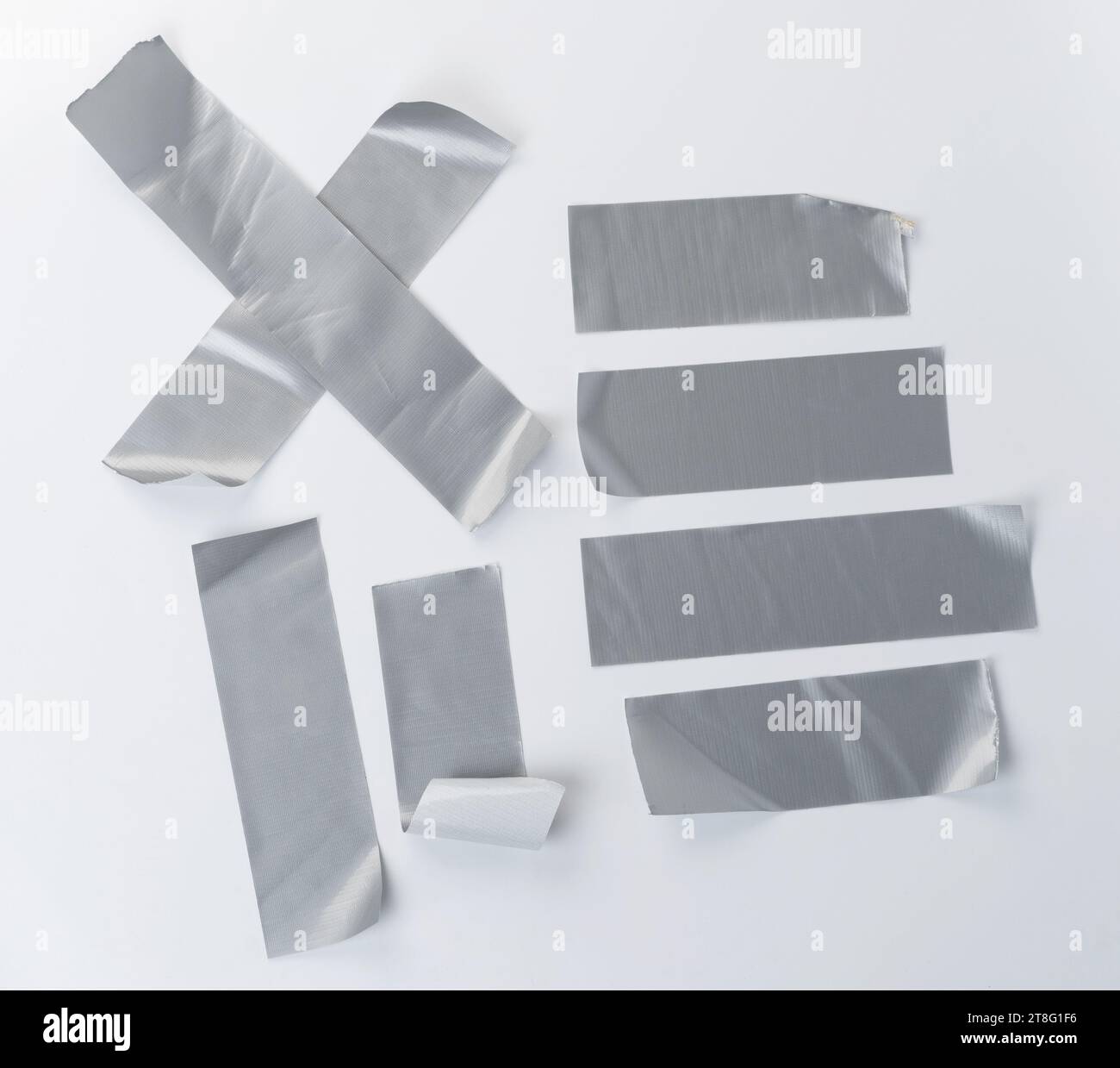 Grey duct tape pieces line and cross isolated on white studio ...