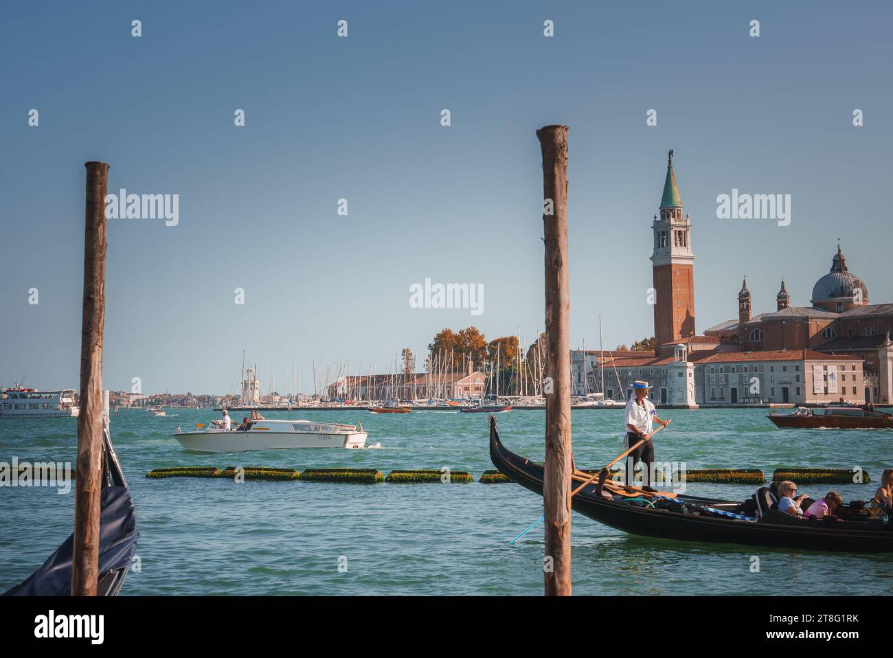 Traditional black gondolas on the Grand Canal in Venice, Italy with no ...