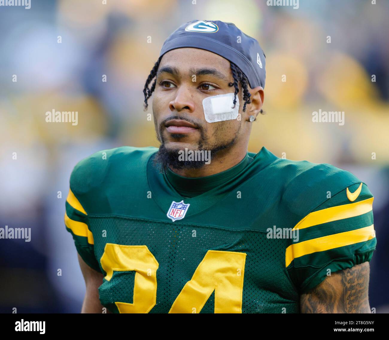 Green Bay Packers safety Jonathan Owens (34) walks on the field before ...