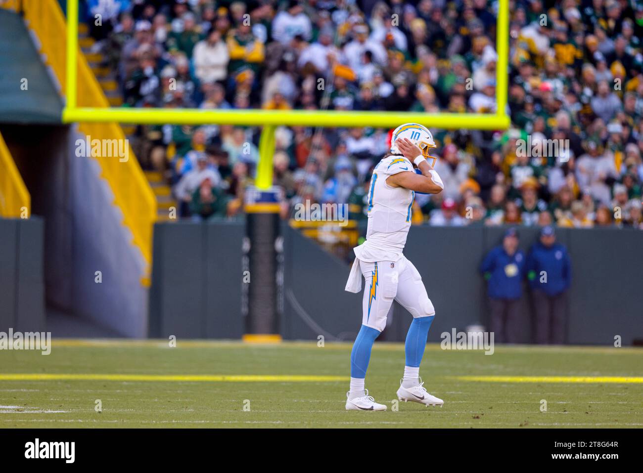 Los Angeles Chargers quarterback Justin Herbert (10) covers his ears ...