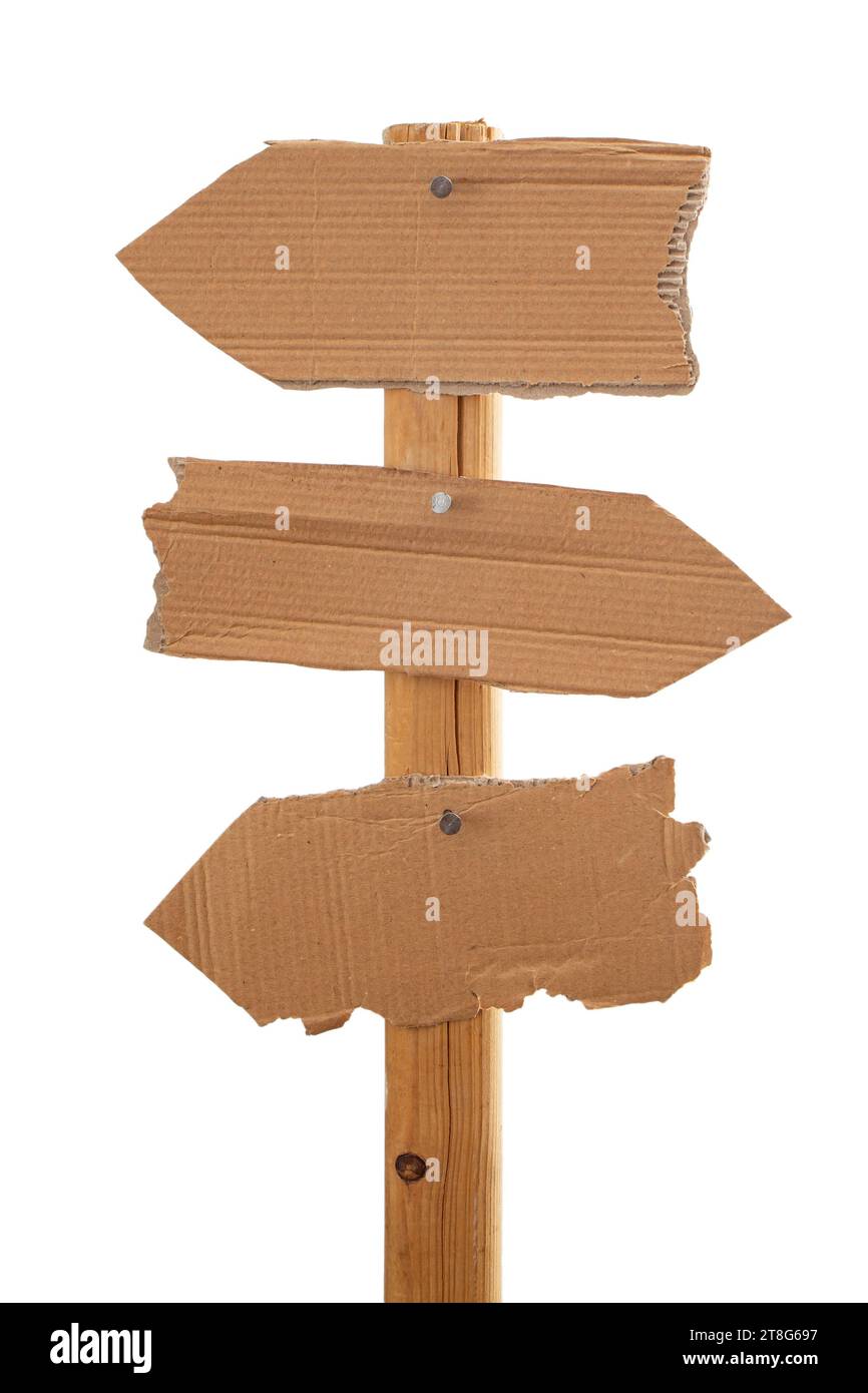 Three different directions arrow signs made of ripped cardboard on a ...