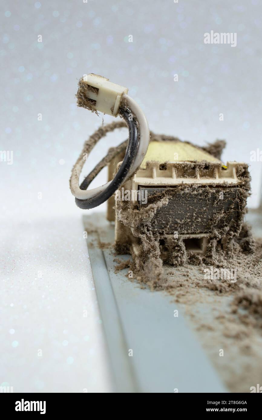 Dusty pc power supply component on gray glitter background, soft focus ...
