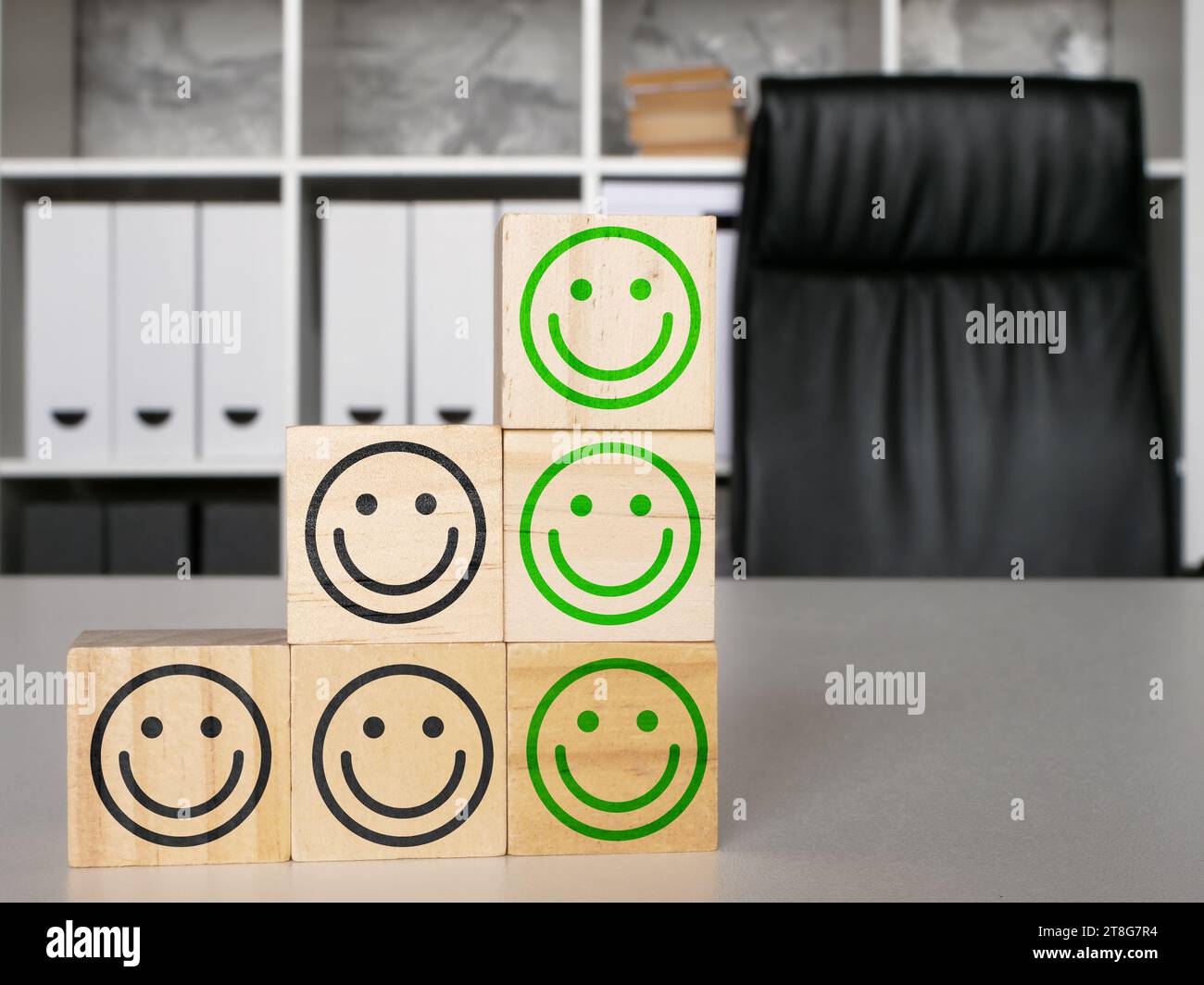 Employee satisfaction survey. Cubes with happy faces in the office ...