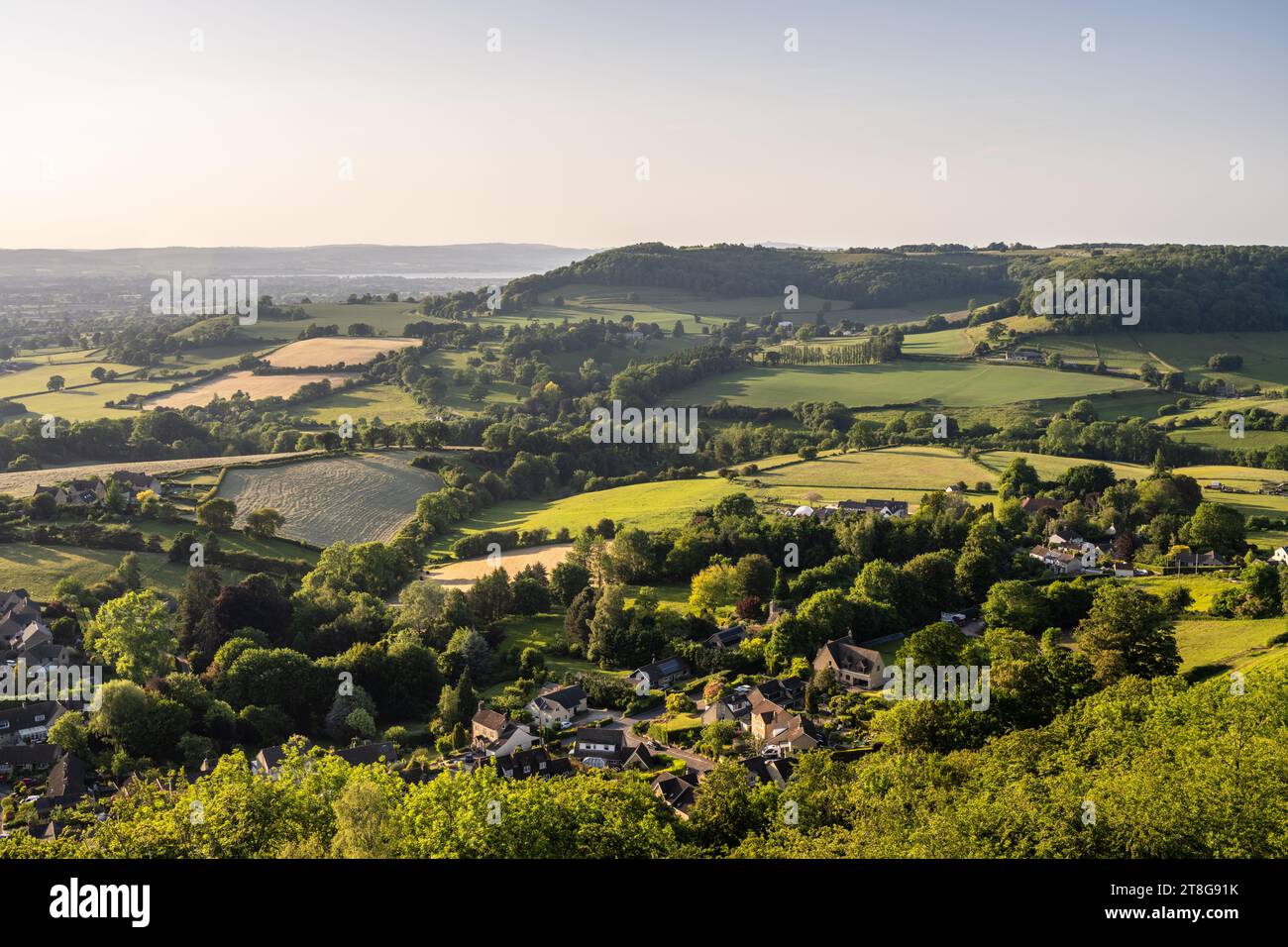 Evening sun casts shadows across the agricultural landscape of ...